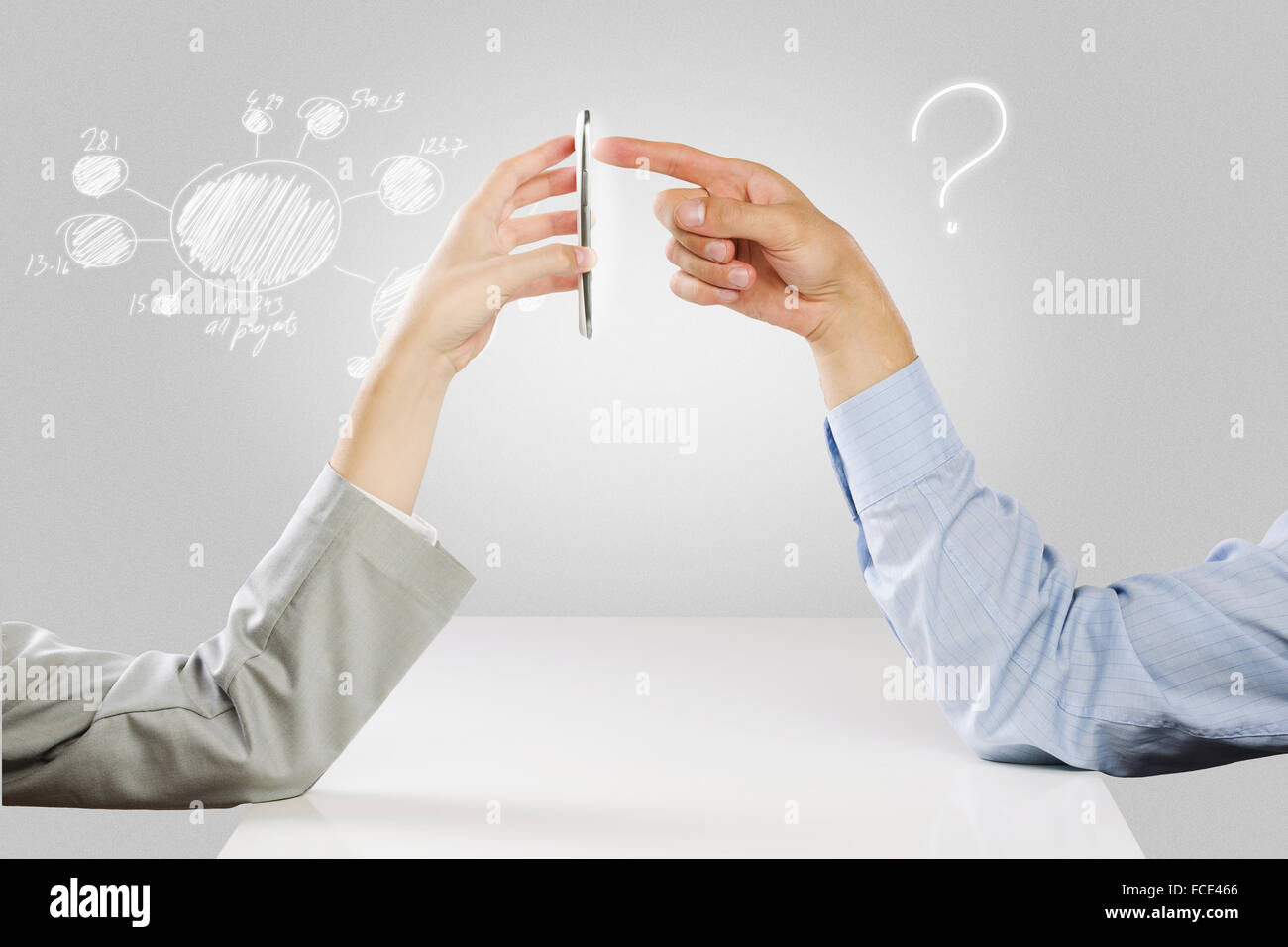 Two business people using one mobile phone at the same time Stock Photo ...