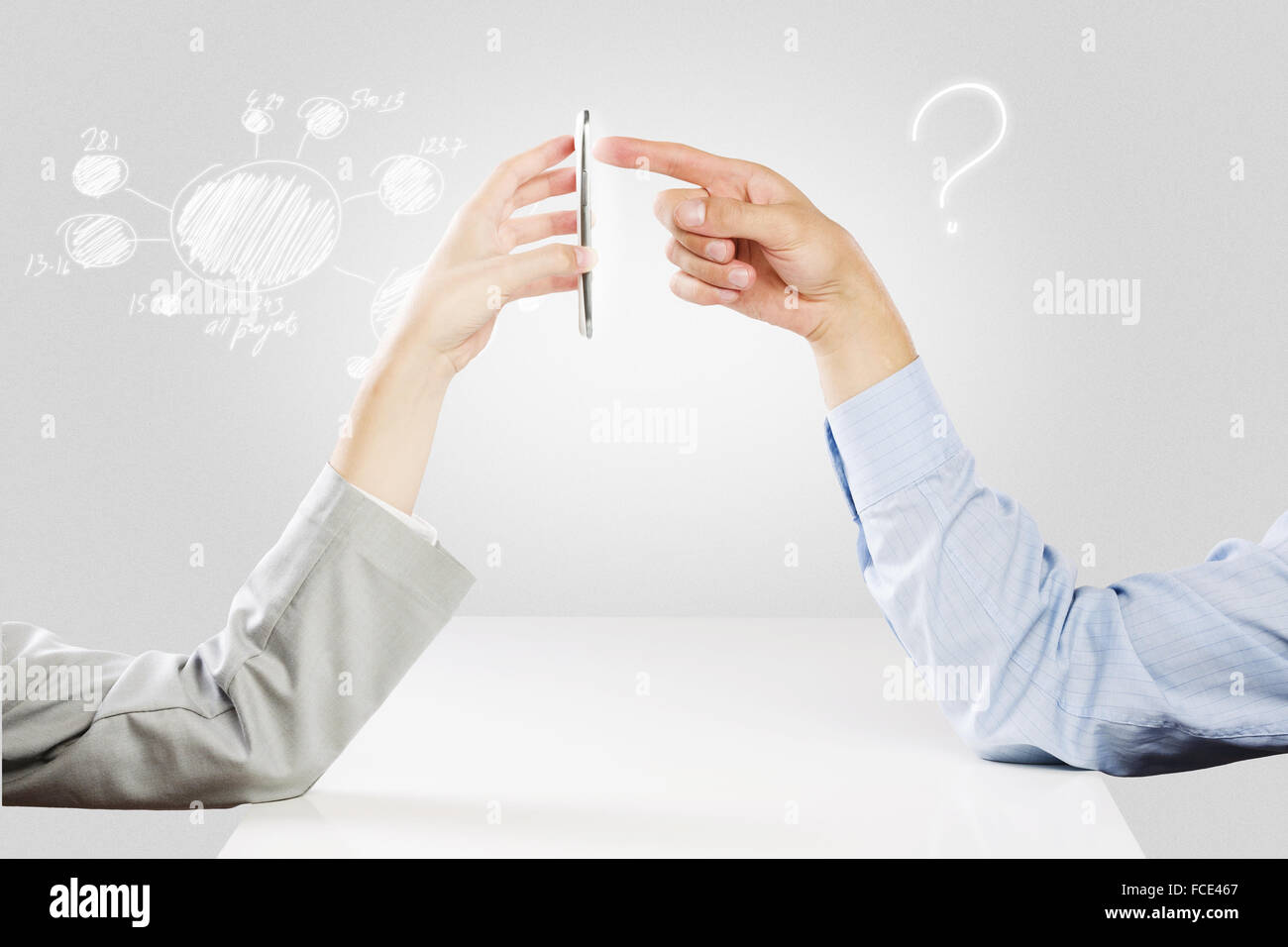 Two business people using one mobile phone at the same time Stock Photo ...