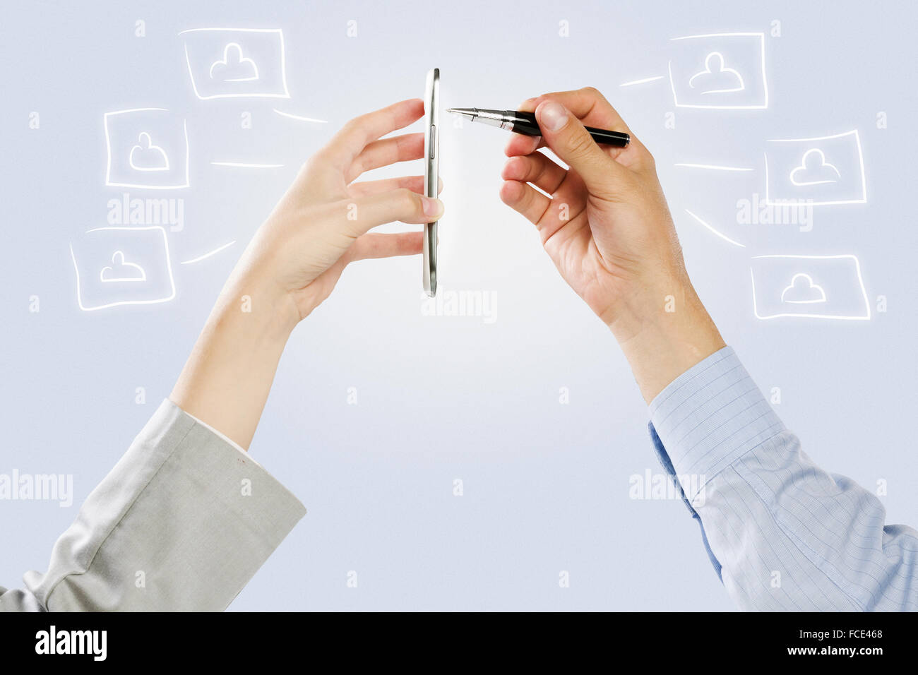 Two business people using one mobile phone at the same time Stock Photo ...