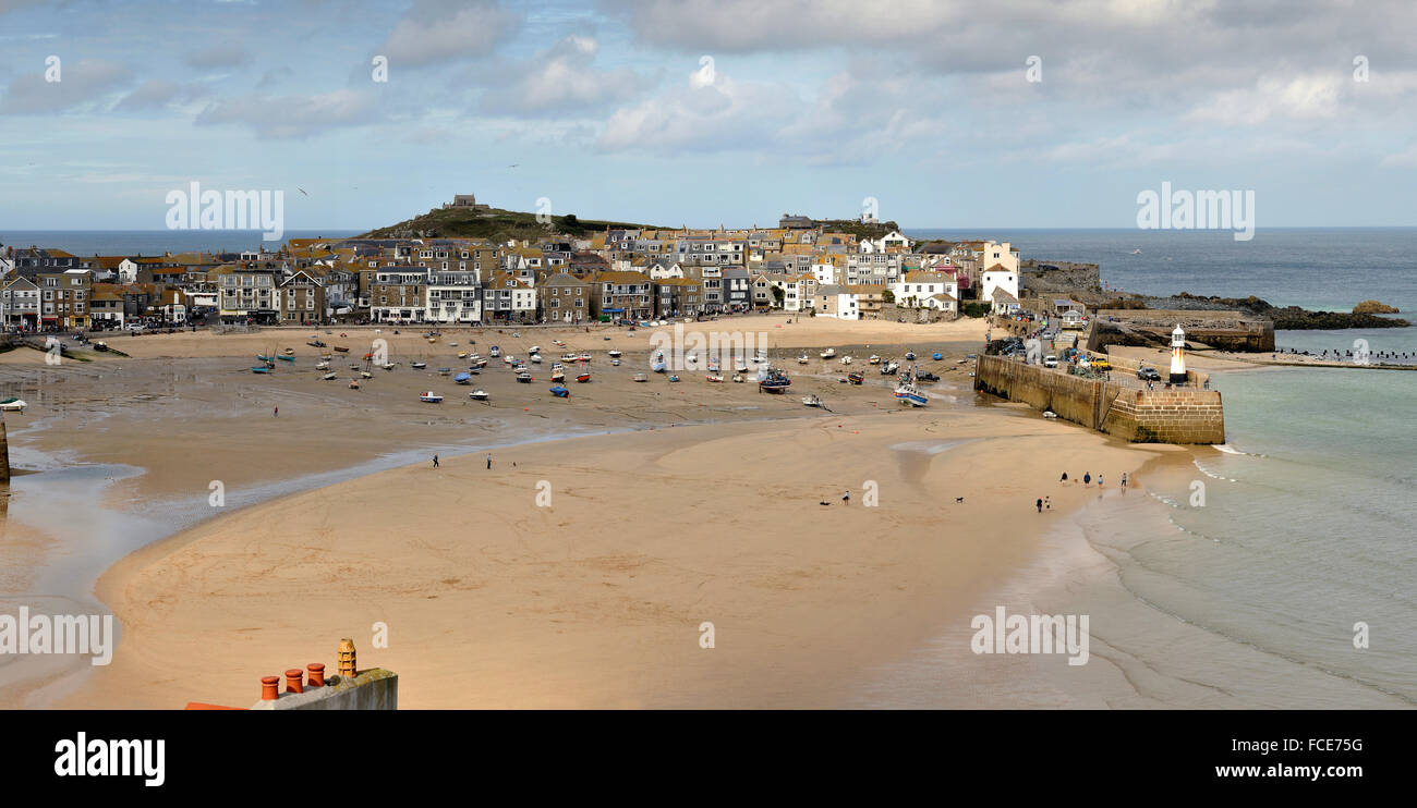 Panorama of St Ives, Cornwall at low tide on a fine day with lighthouse ...