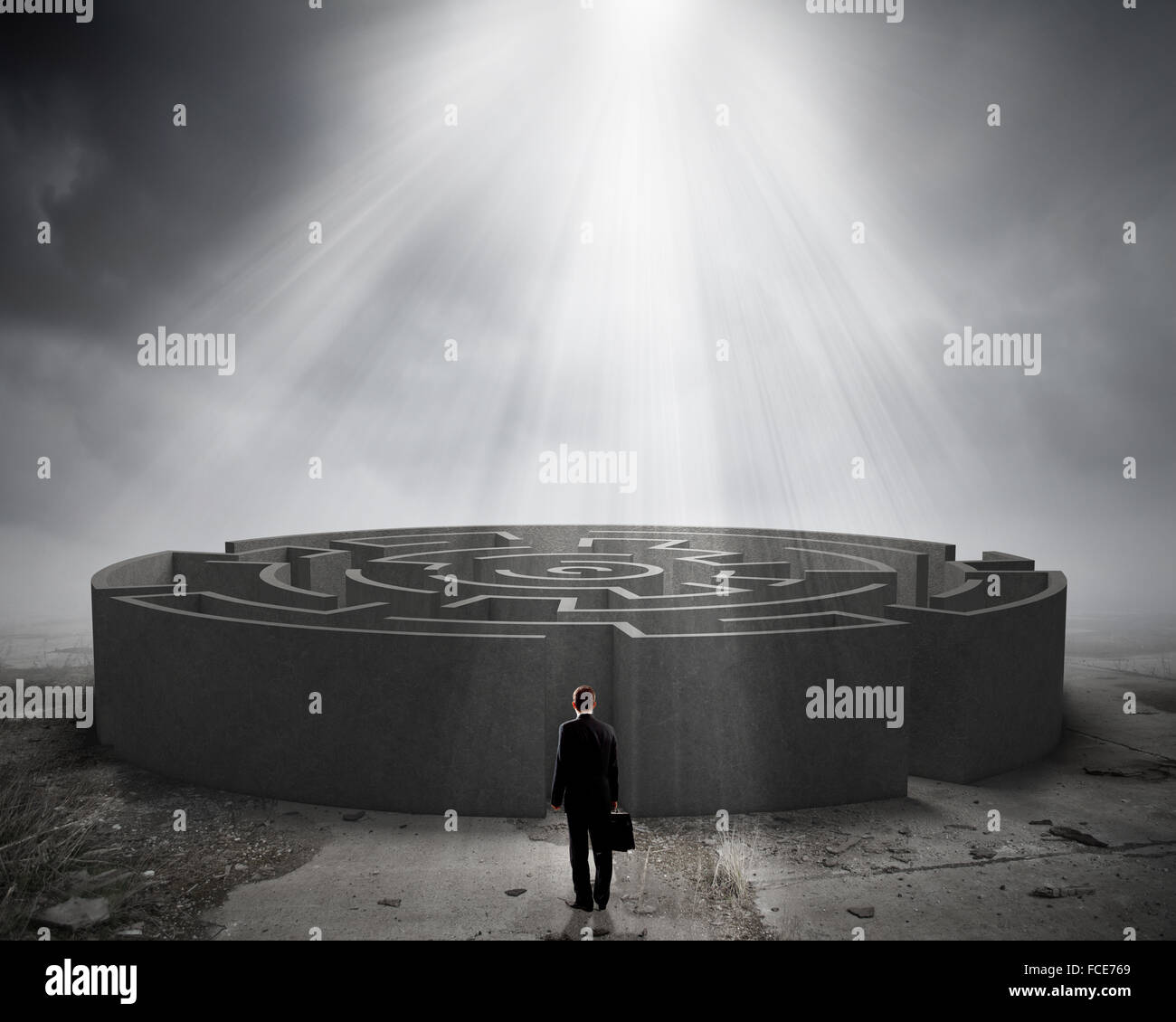 Rear view of businessman entering round white labyrinth Stock Photo - Alamy