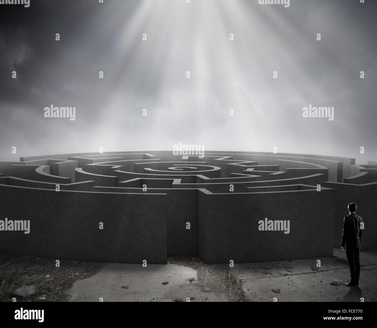 Rear view of businessman entering round white labyrinth Stock Photo - Alamy