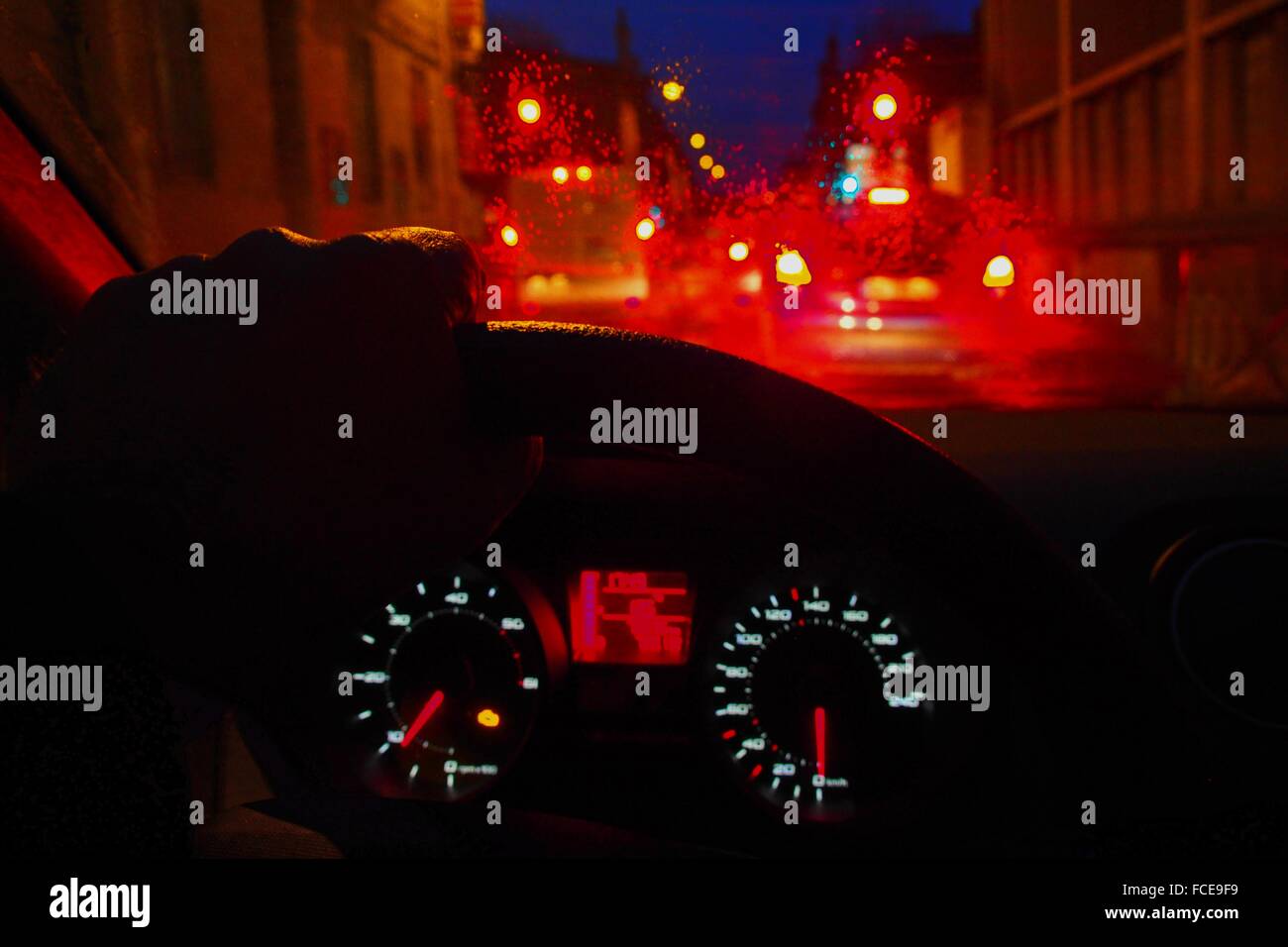 Heavy traffic by night under rain Stock Photo - Alamy