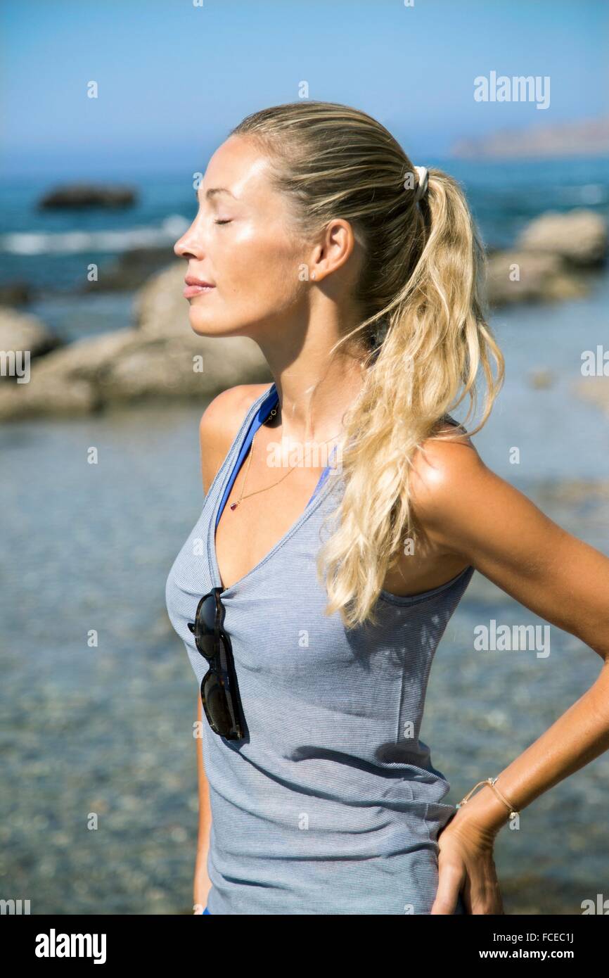 Young woman at seaside Stock Photo - Alamy
