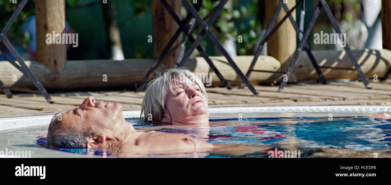 Man sleeping swimming pool hi-res stock photography and images - Alamy