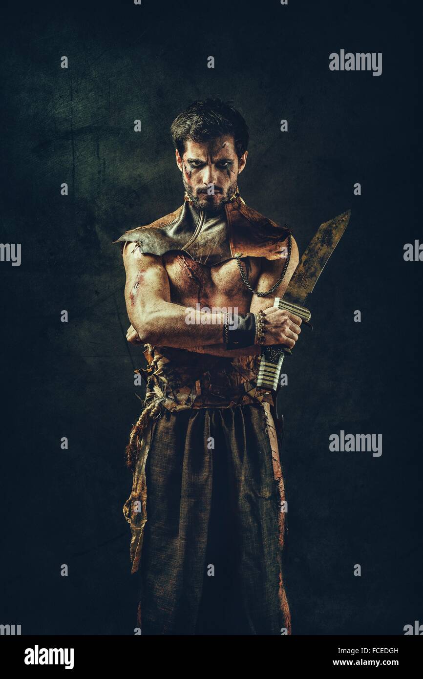 Portrait of a tribal warrior standing arms crossed Stock Photo - Alamy