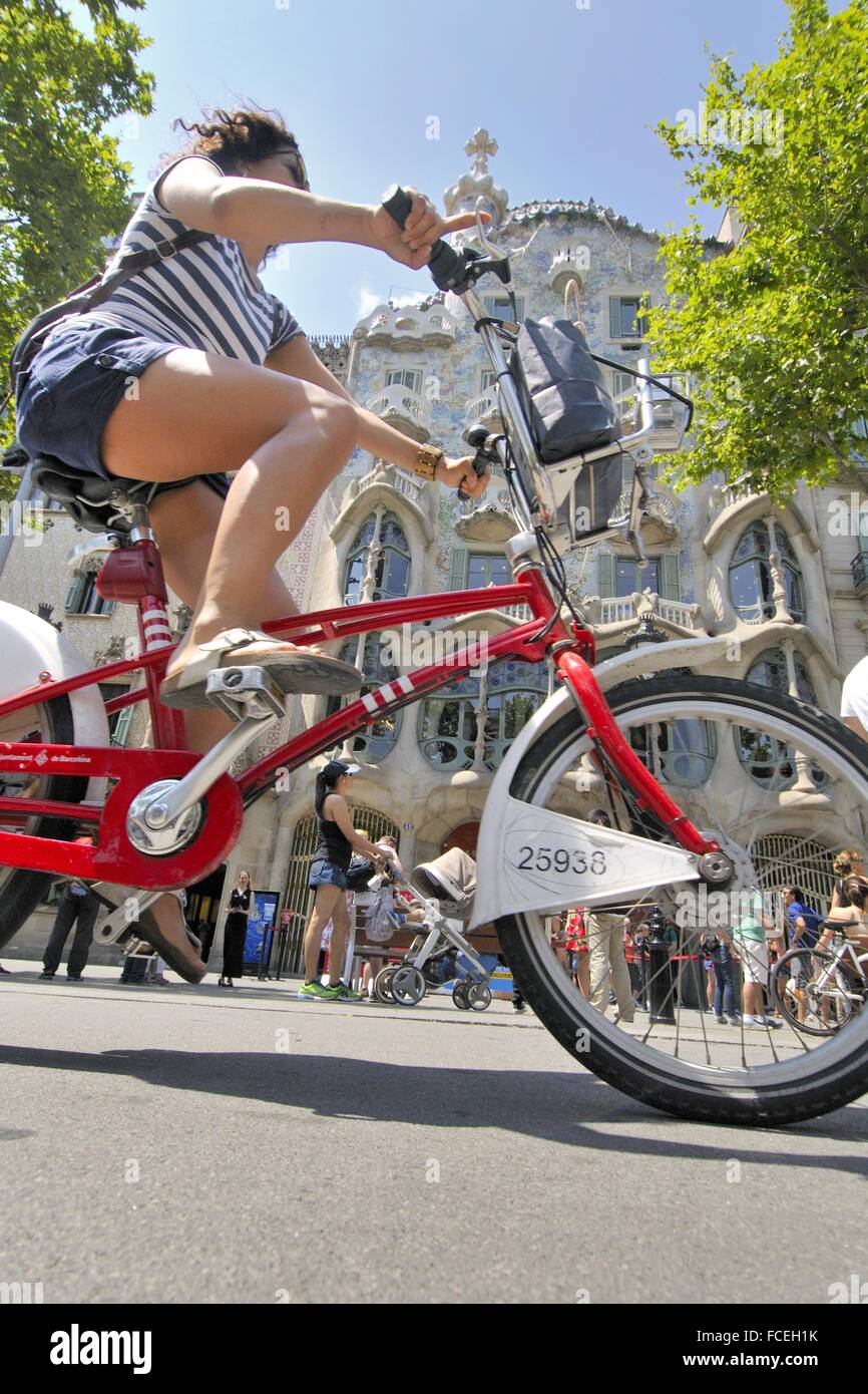 Urban cyclist. Casa Batlló, passeig de Gracia 43 built in 1877 and ...