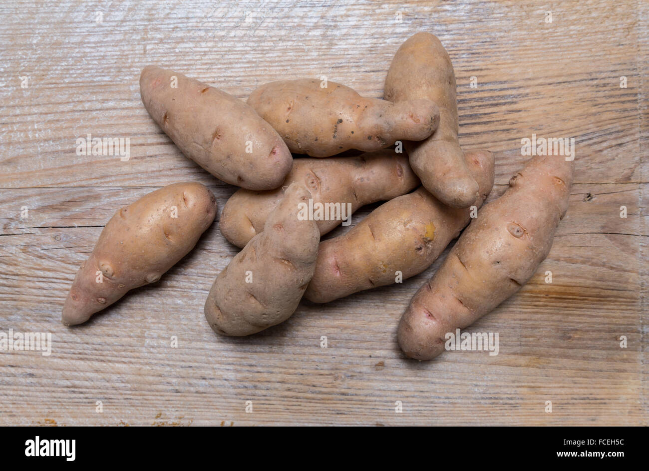 Potatoes on rustic wood Concept Stock Photo - Alamy