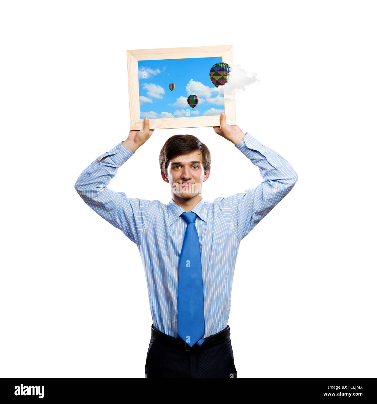 Handsome young man holding frame with pictures Stock Photo - Alamy