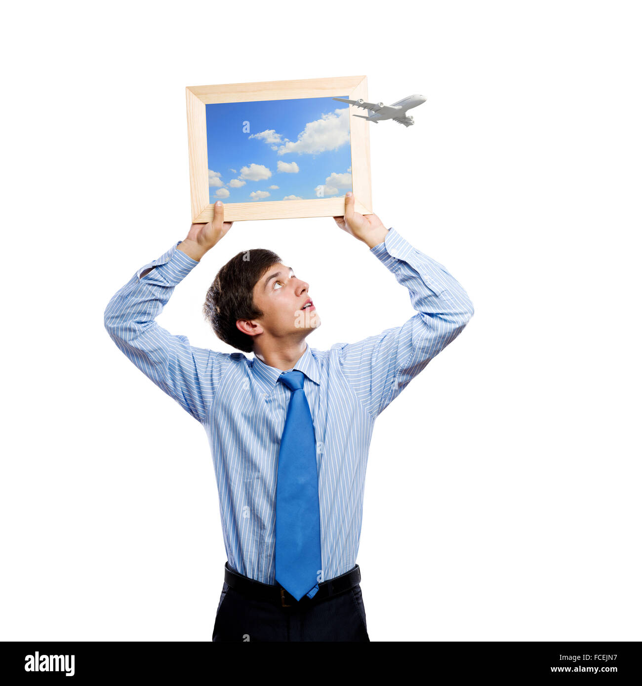 Handsome young man holding frame with pictures Stock Photo - Alamy