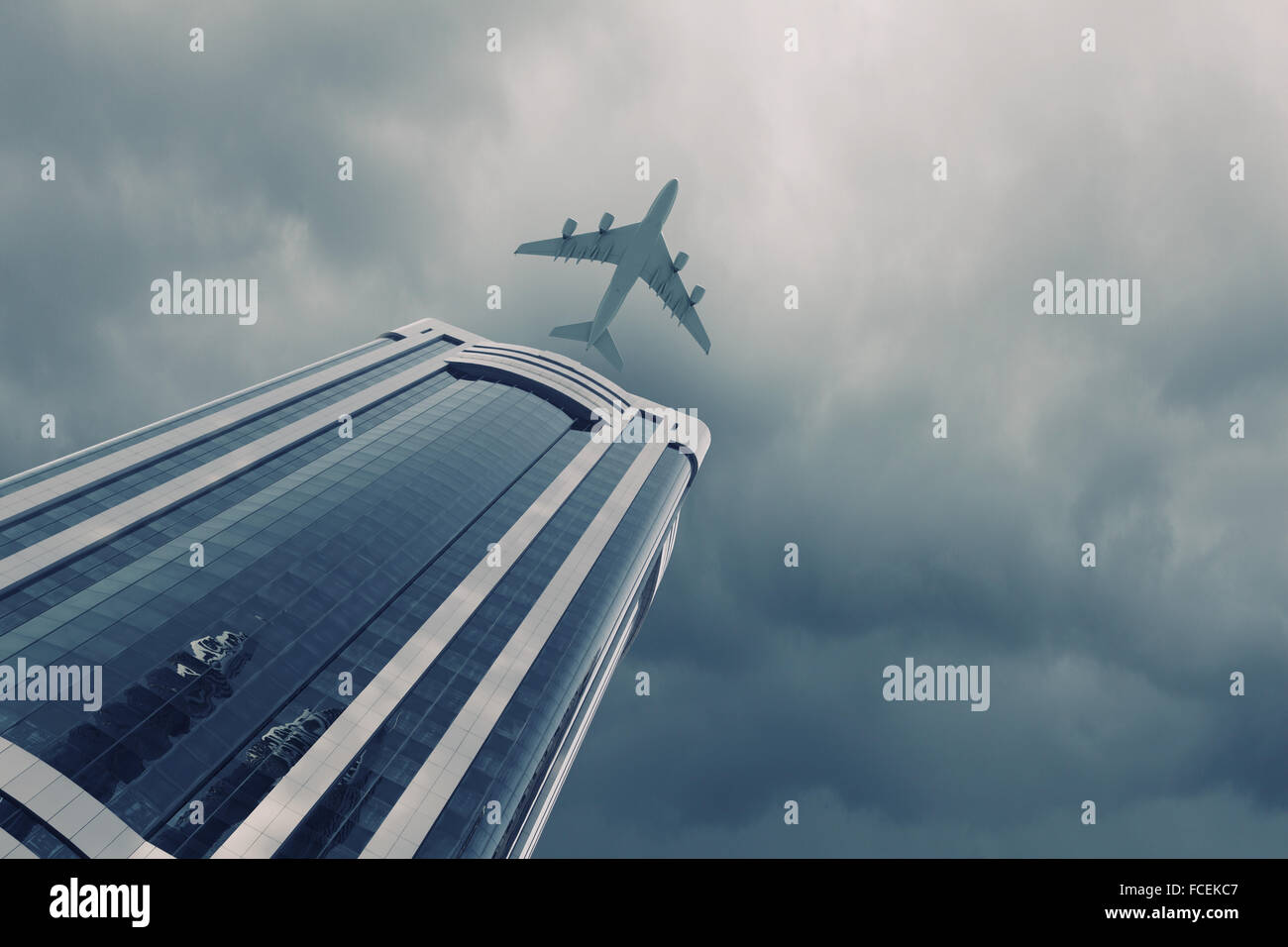 Bottom view of airplane flying above skyscrapers Stock Photo - Alamy