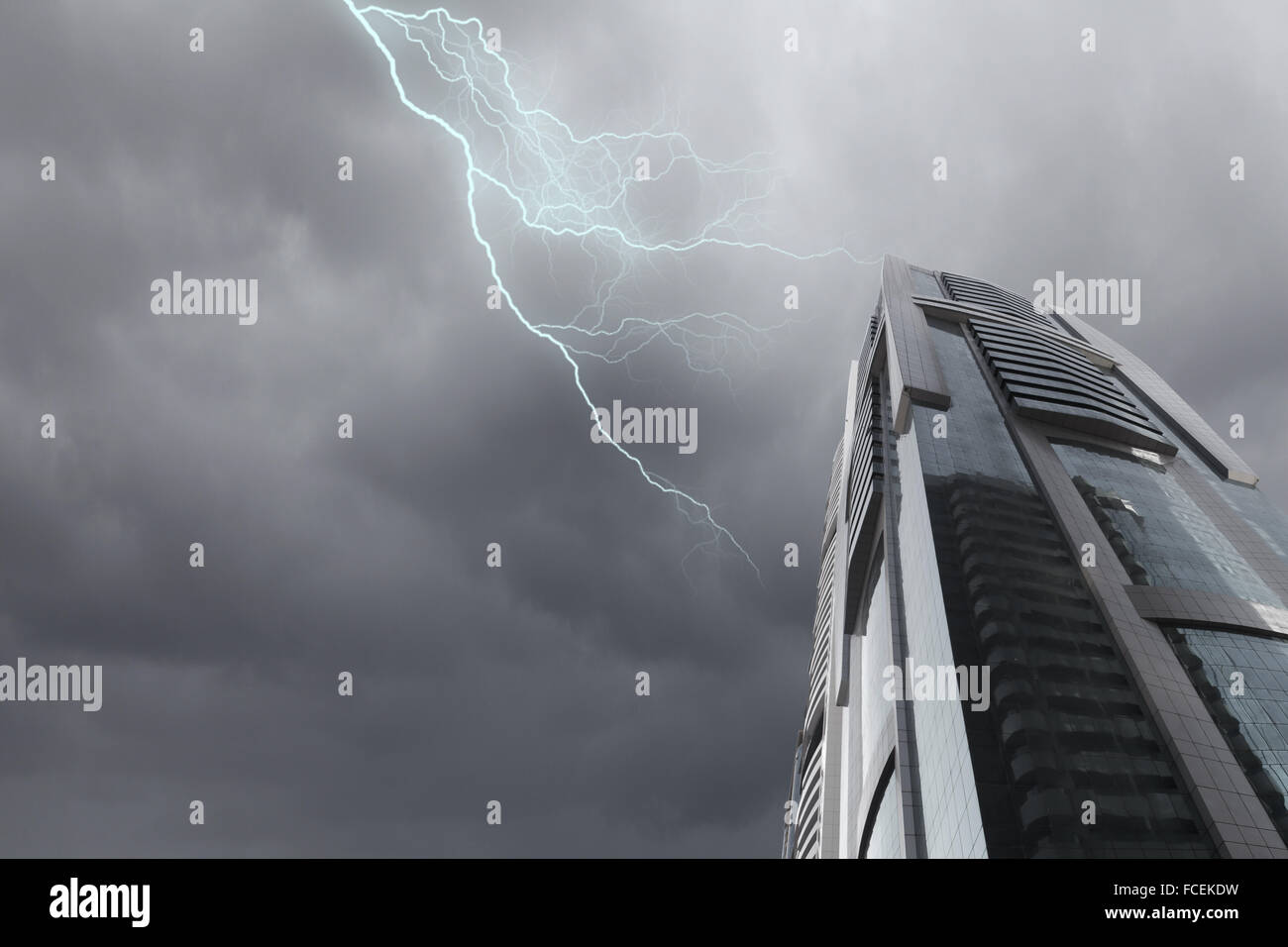Bottom image of skyscraper with thunder lightning in sky Stock Photo ...