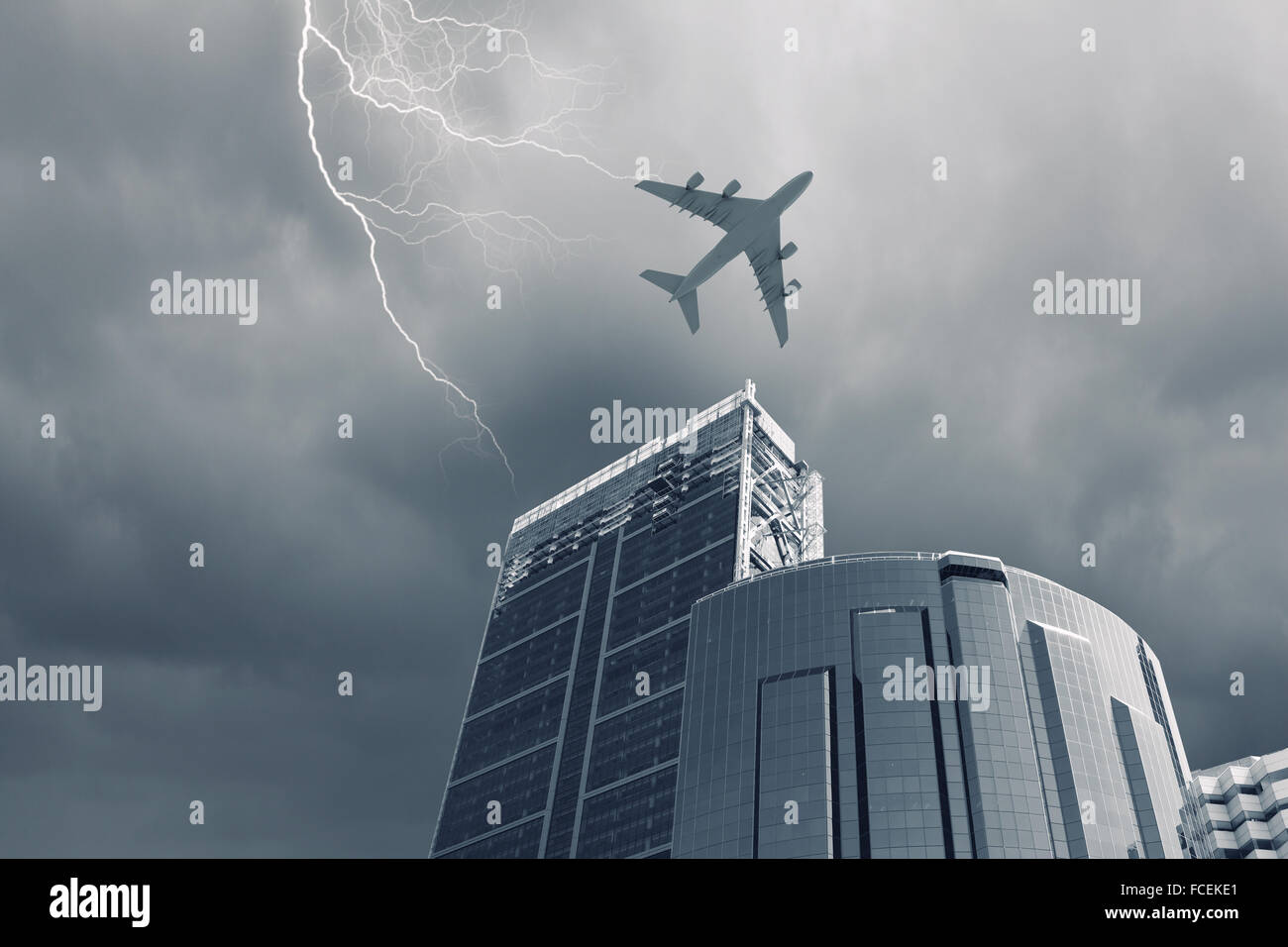 Bottom view of airplane flying above skyscrapers Stock Photo - Alamy