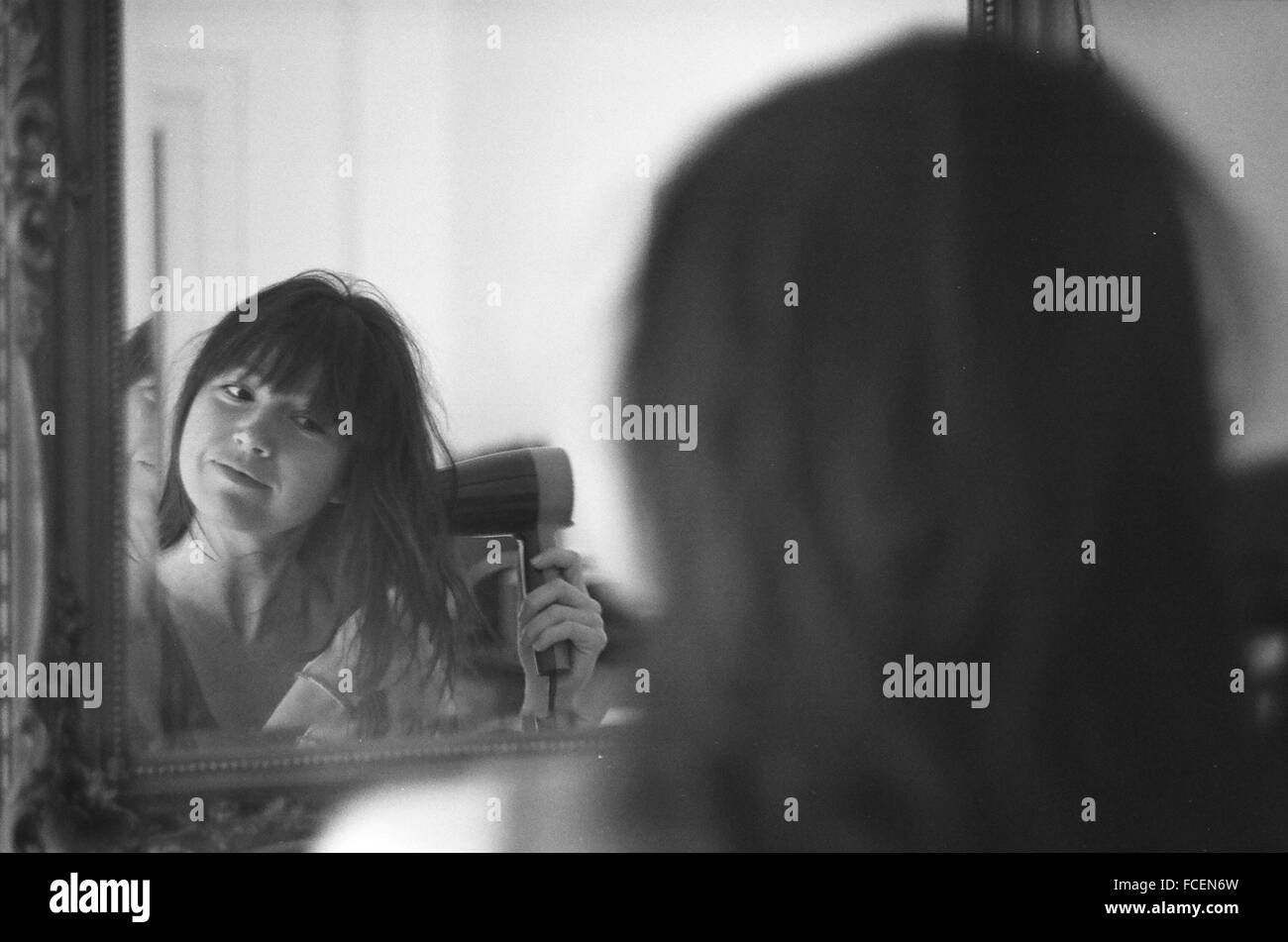 Women drying hair hi-res stock photography and images - Alamy