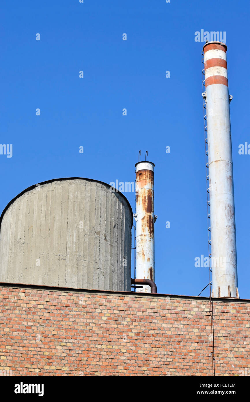 Smoke stacks of a factory Stock Photo - Alamy