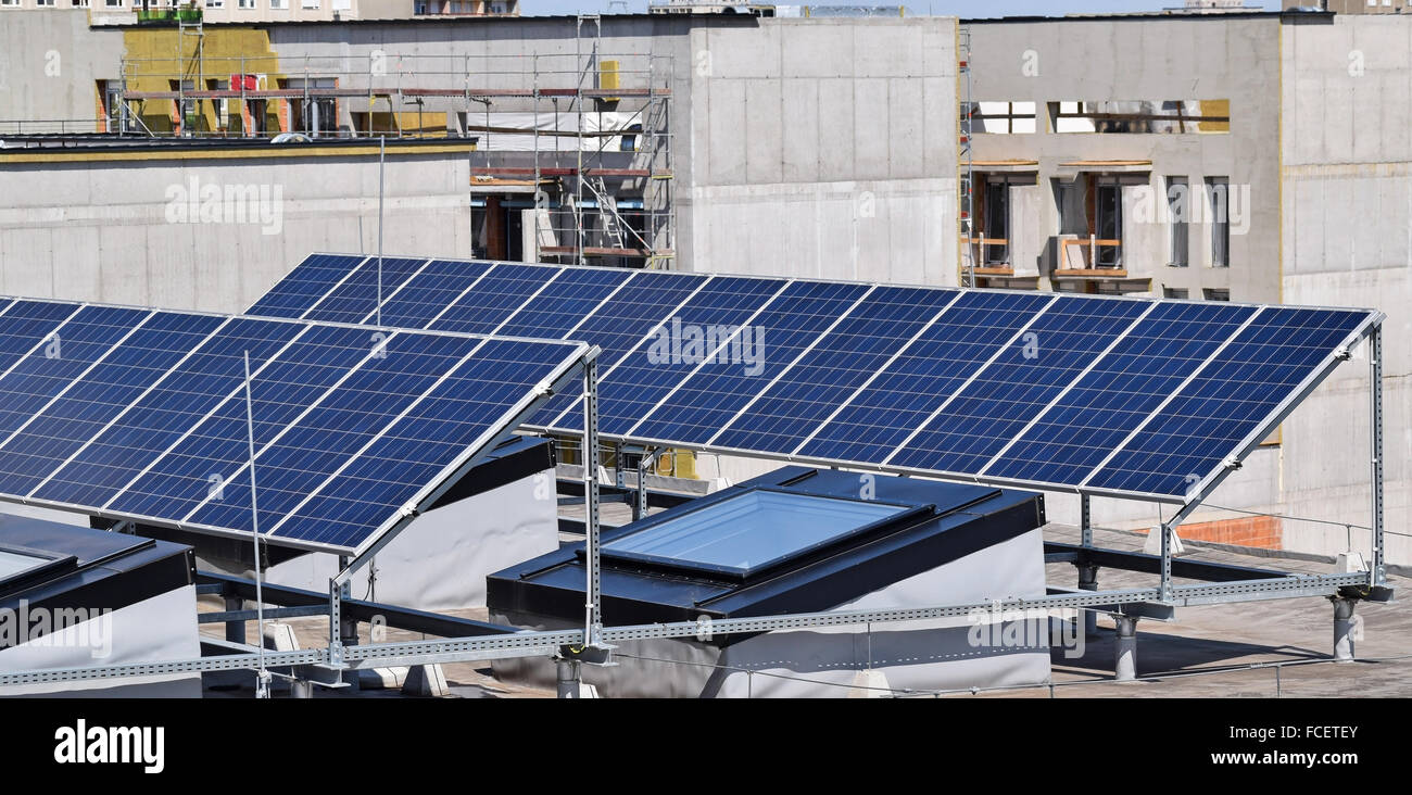 Solar panels on the top of a building Stock Photo - Alamy