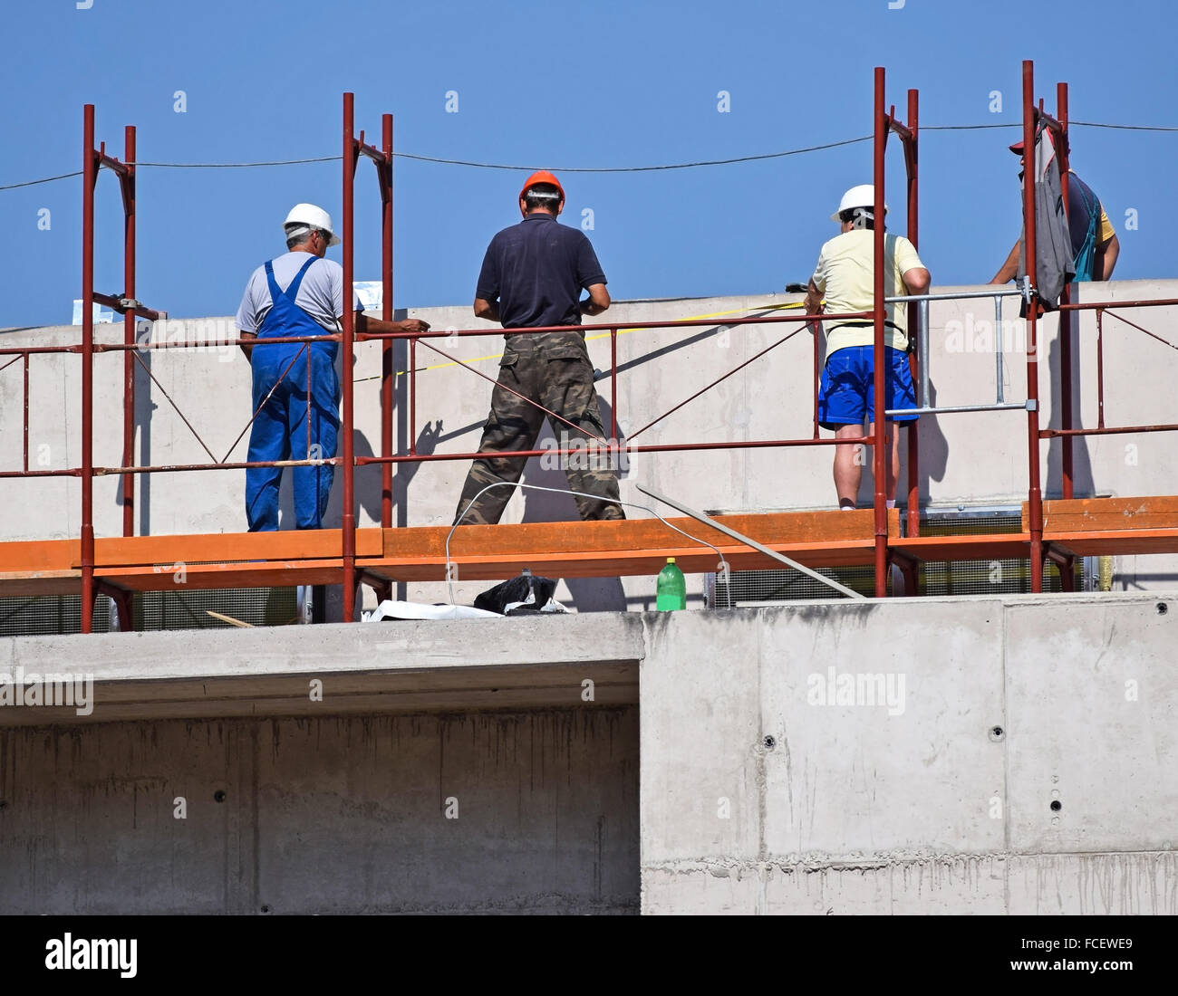 Construction workers at work Stock Photo - Alamy