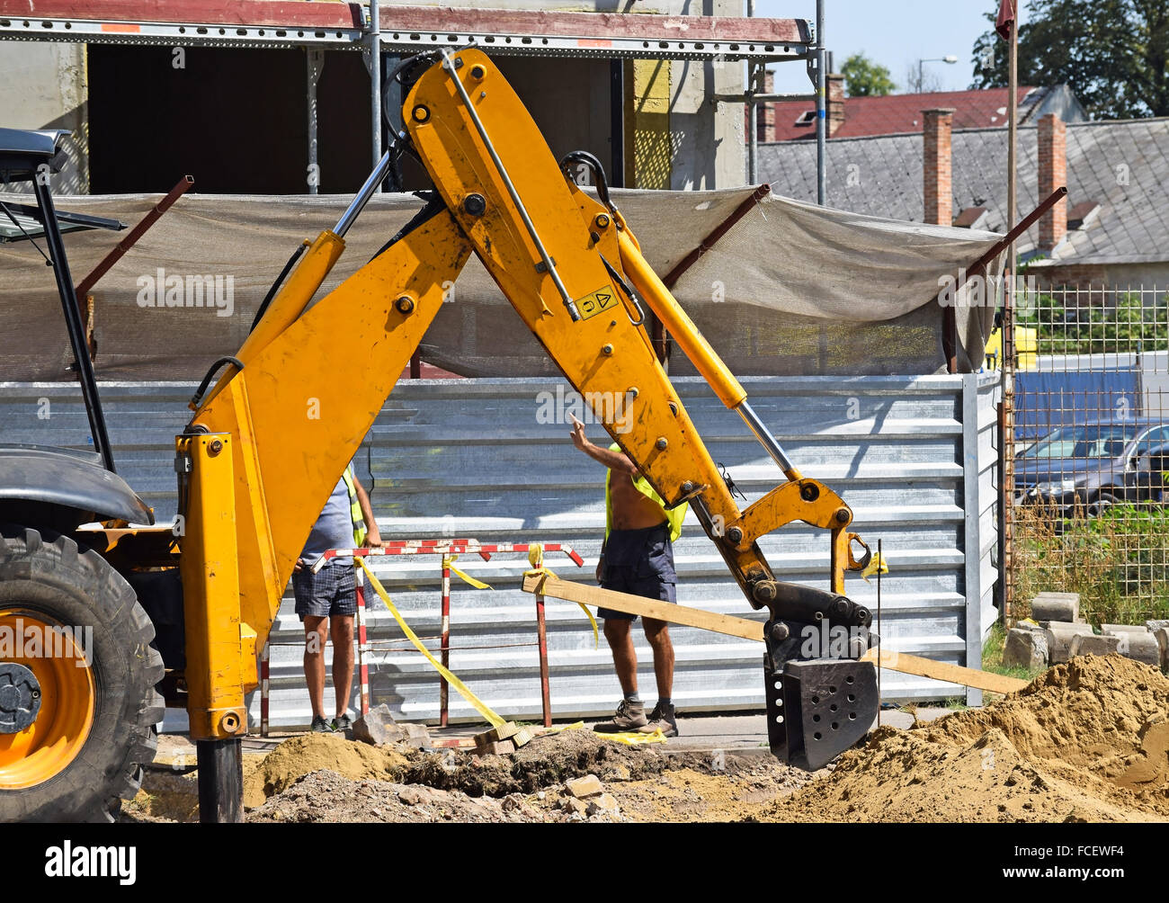 Excavator at the road construction Stock Photo - Alamy