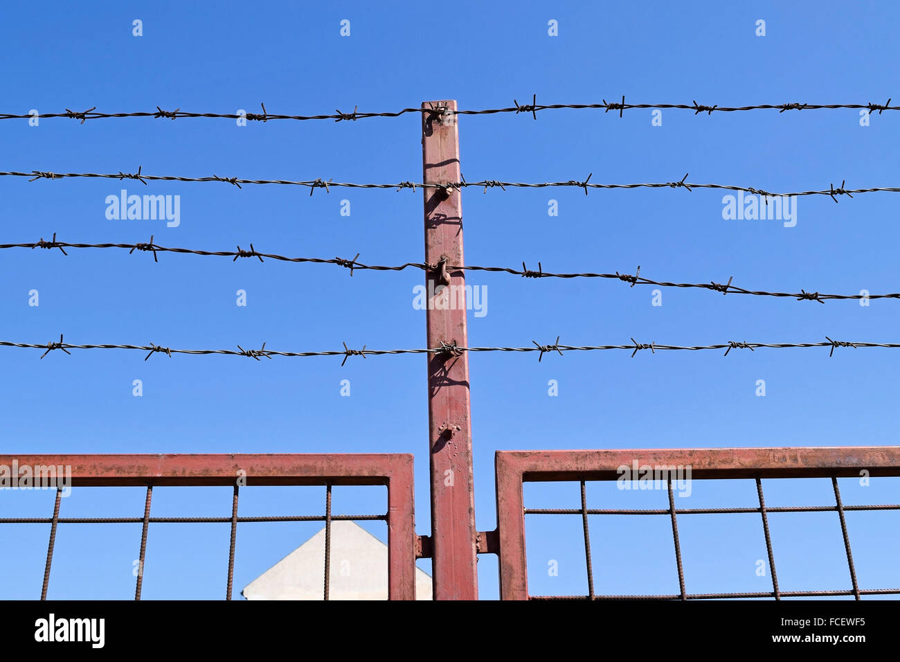 Barbed wire fence of the prison Stock Photo - Alamy