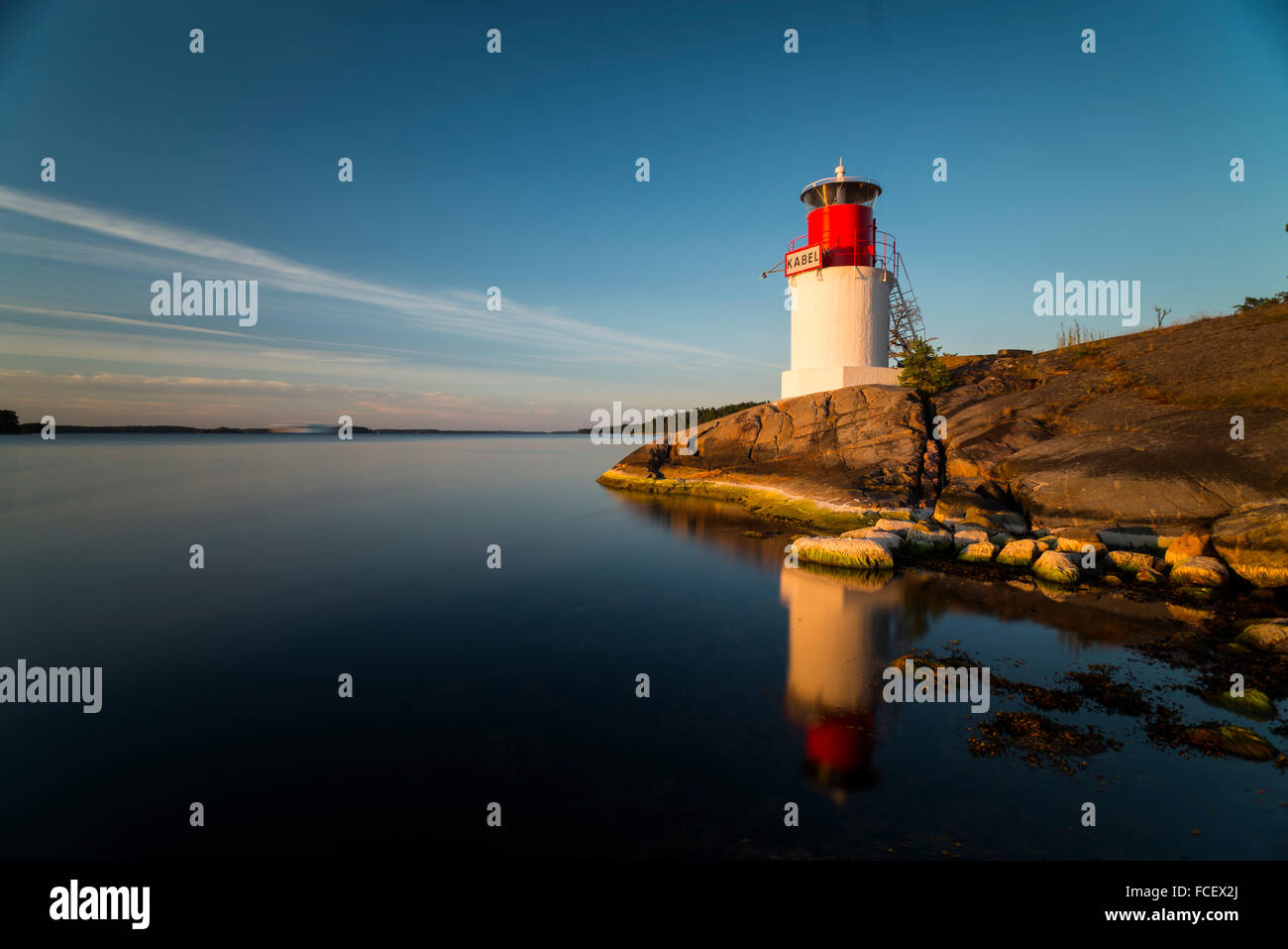 Lighthouse on the rocky coast in the Swedish island Yxlan in the ...