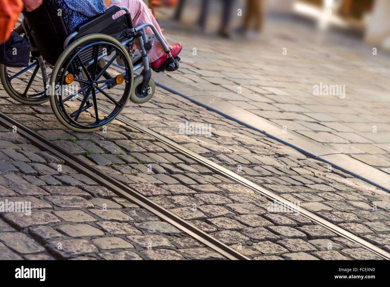 Wheelchair crossing a tram way, Ghent, Belgium Stock Photo - Alamy