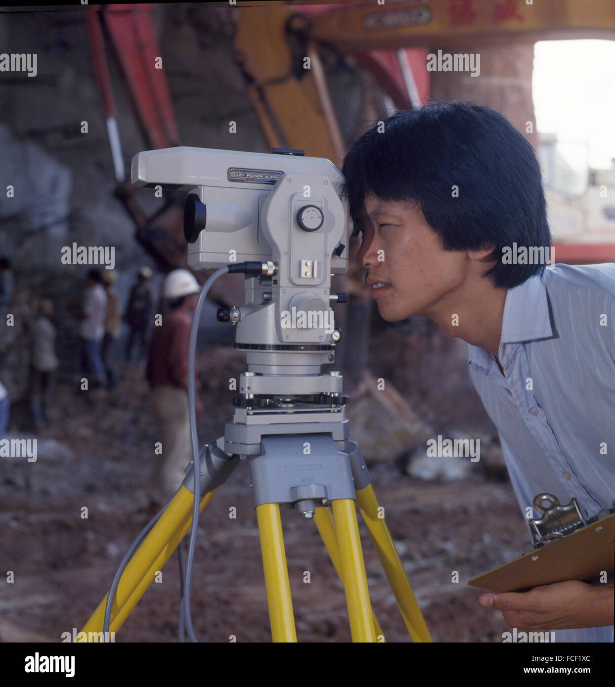 Chinese building surveyor on site Stock Photo - Alamy