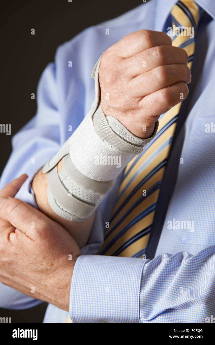 Close Up Of Businessman Suffering With Repetitive Strain Injury (RSI ...