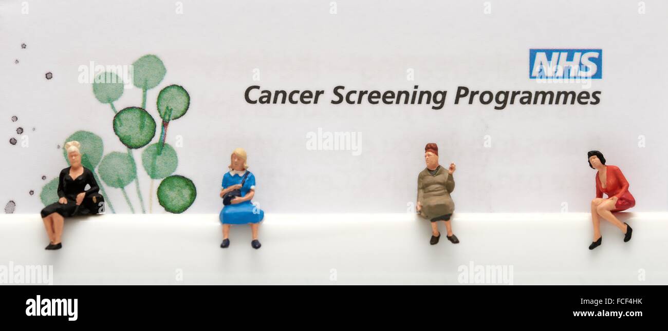 NHS cancer screening programmes leaflet close up with miniature female ...