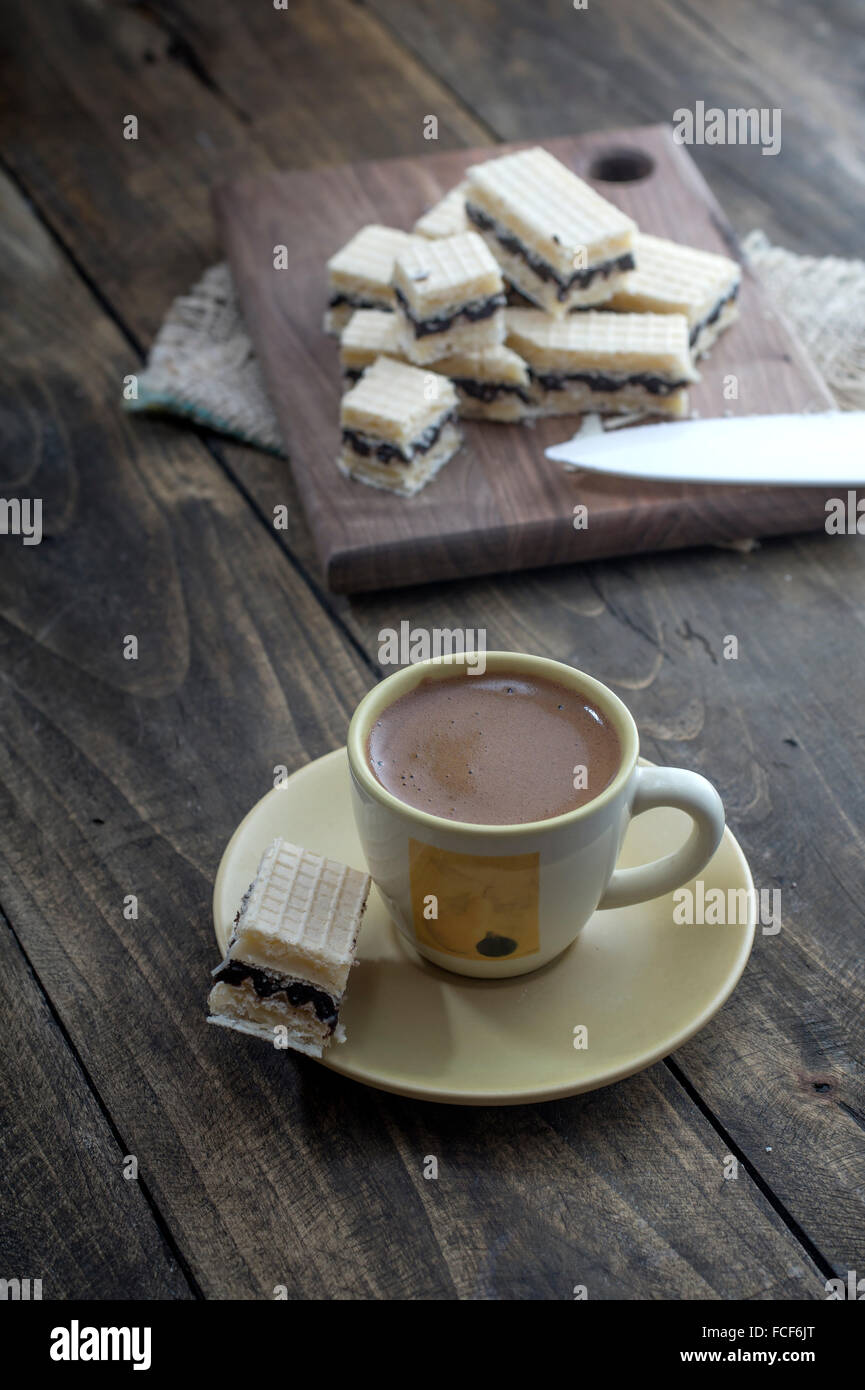 Waffle cake with chocolate and coffee on table Stock Photo - Alamy