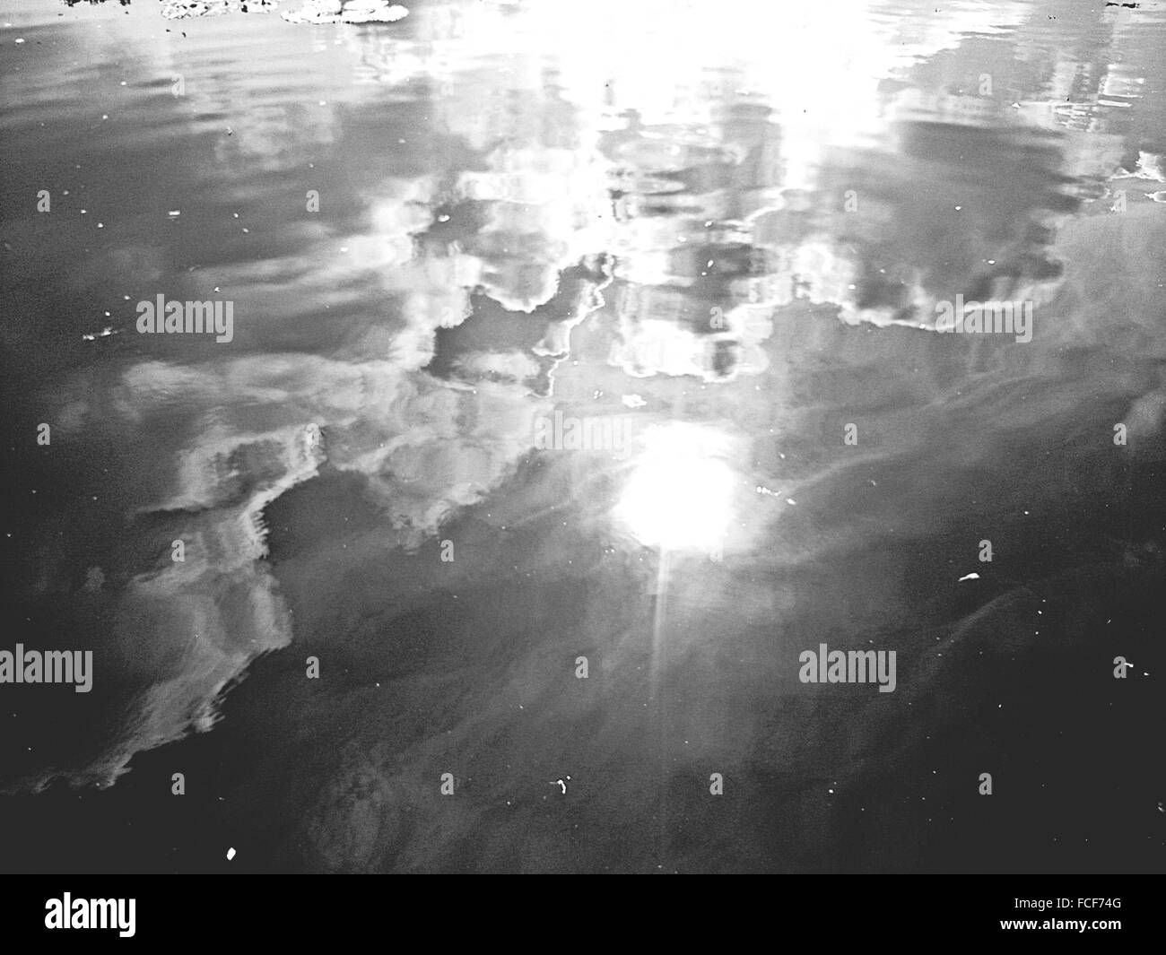 Reflection Of Sun In Lake Stock Photo - Alamy