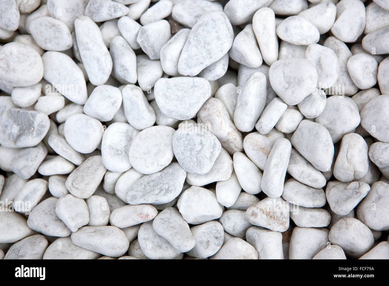Closeup of white stones at a grave for background Stock Photo - Alamy