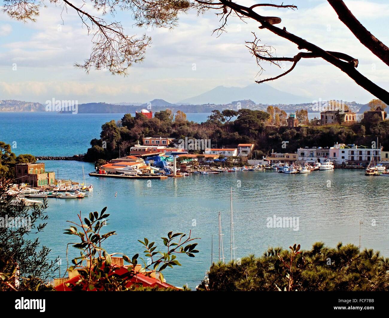 Overlooking the harbor of Ischia Porto at low sun . The dark color of ...