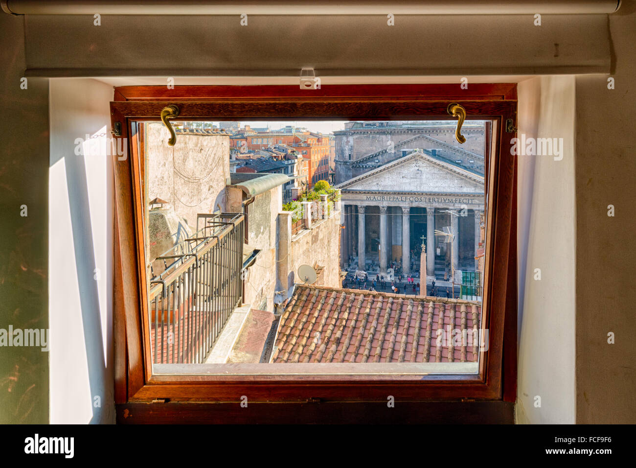 window overlooking the rooftops of Rome, historic palaces, Catholic ...