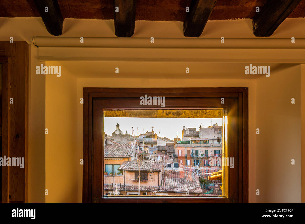 window overlooking the rooftops of Rome, historic palaces, Catholic ...