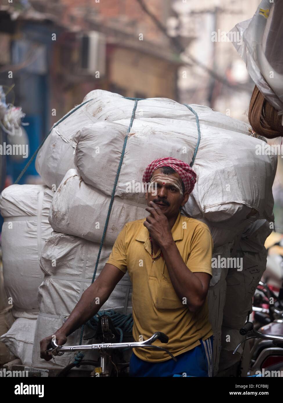Man pulling overloaded cycle cart, Varanasi, Uttar Pradesh, India Stock ...