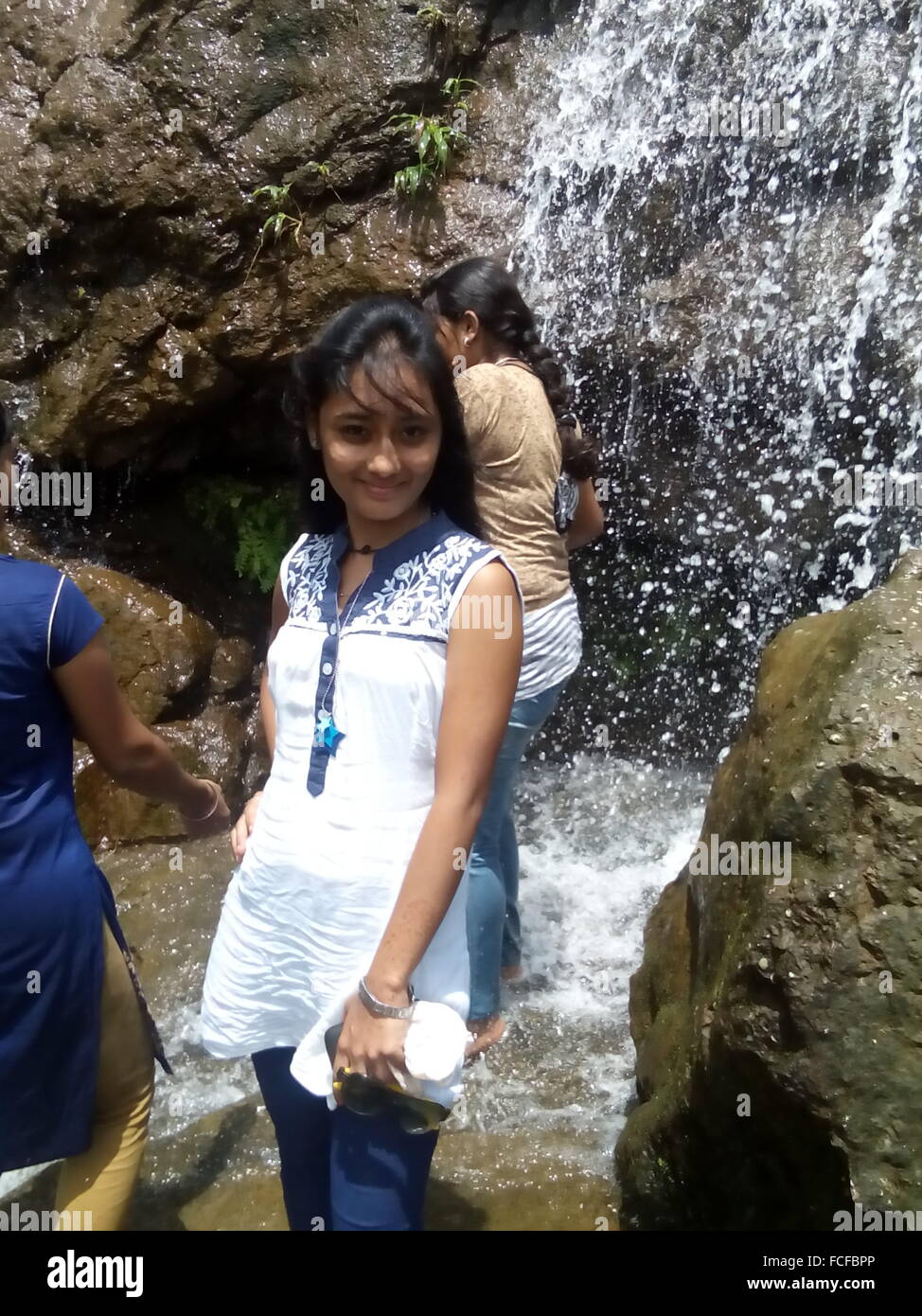 Women and waterfall hi-res stock photography and images - Alamy