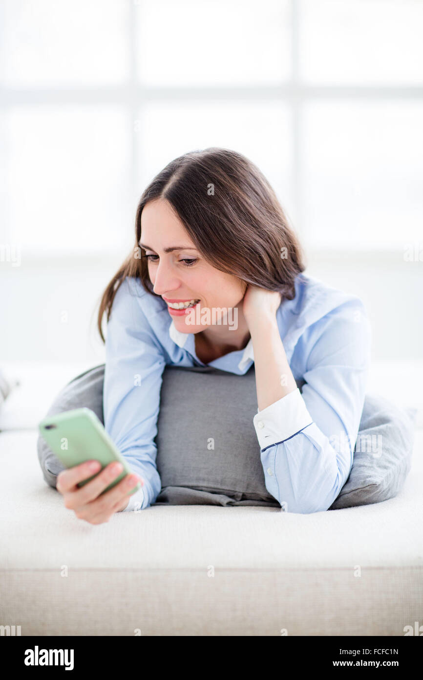 Iphone adult living room hi-res stock photography and images - Alamy