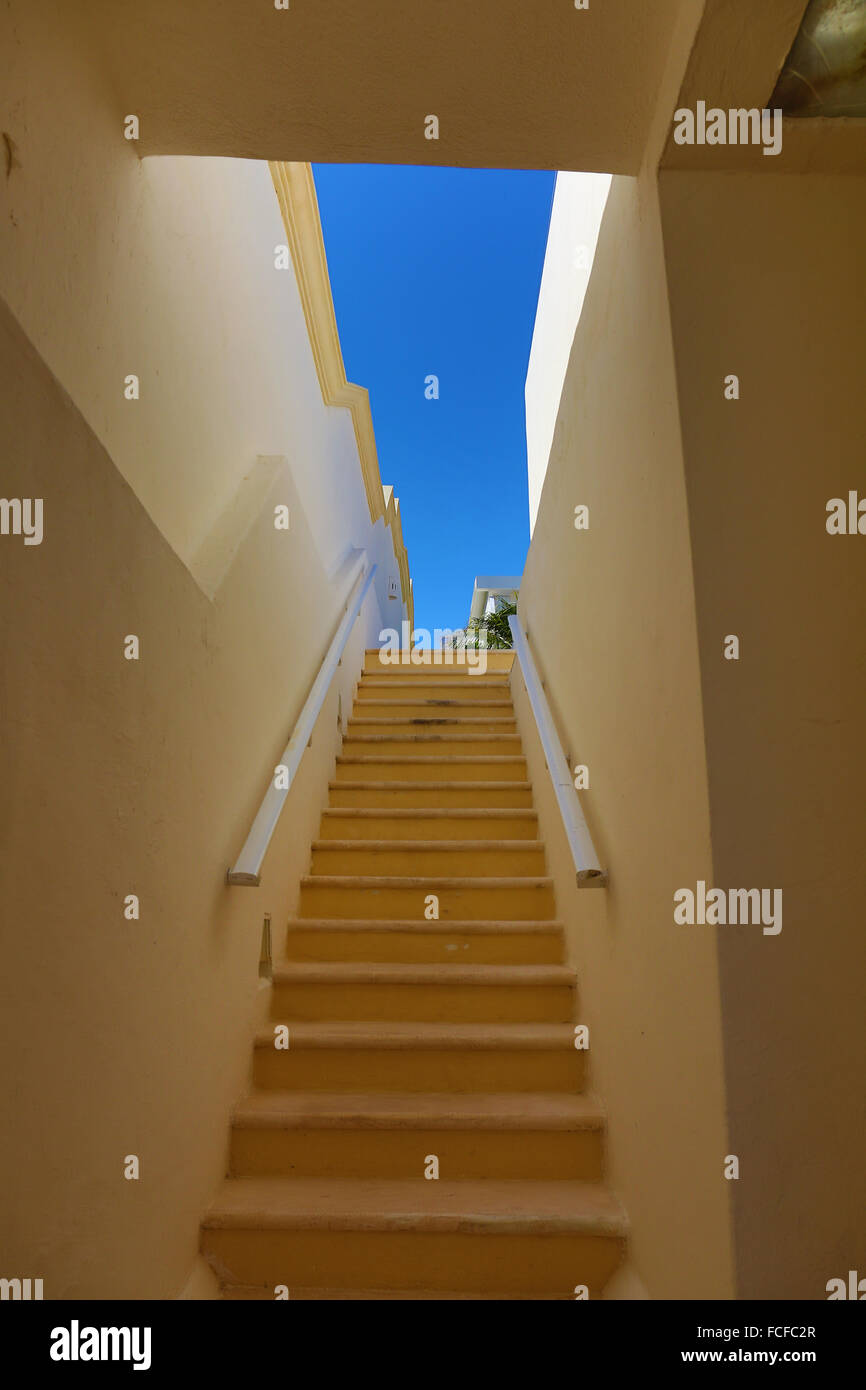 Looking up at the blue sky through a stone staircase Stock Photo - Alamy