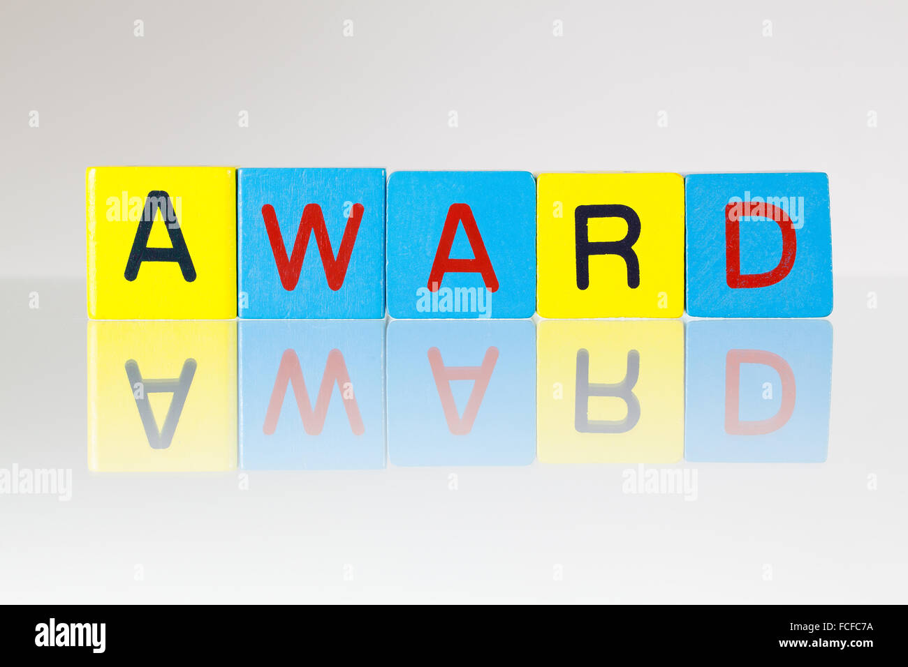Award - an inscription from children's wooden blocks Stock Photo - Alamy