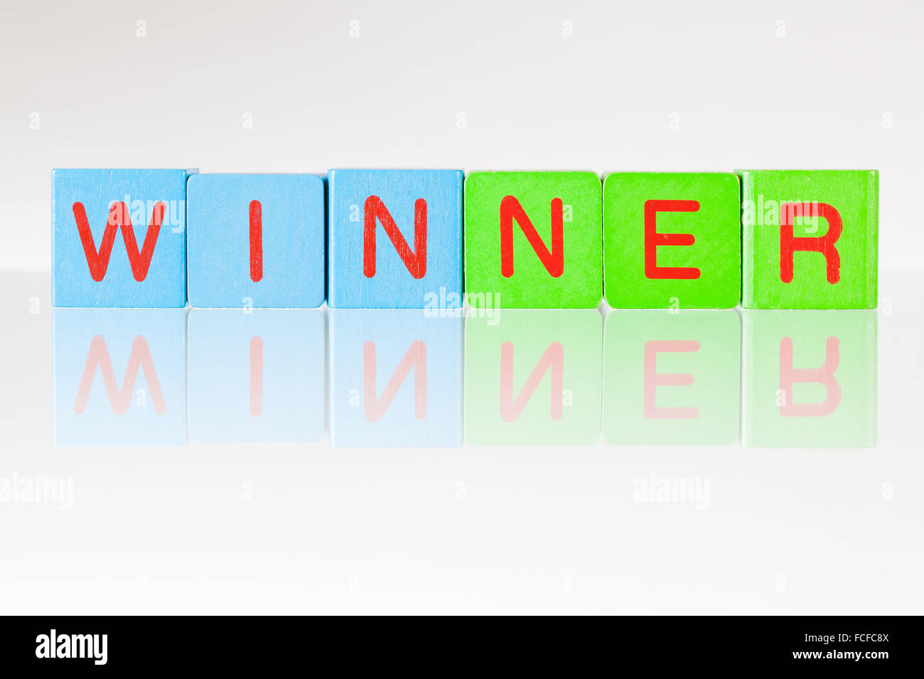 Winner - an inscription from children's wooden blocks Stock Photo - Alamy