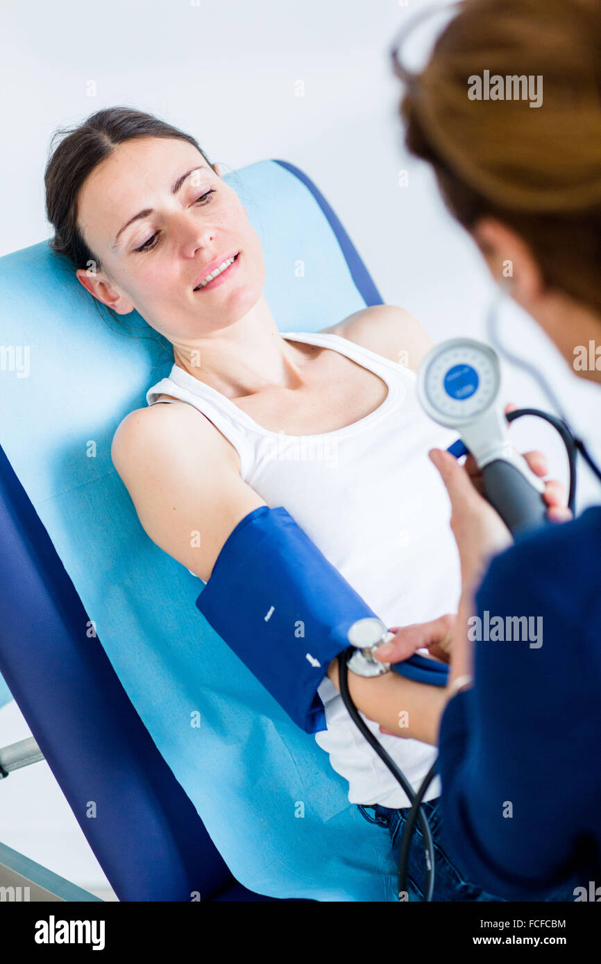 Blood pressure woman hi-res stock photography and images - Alamy