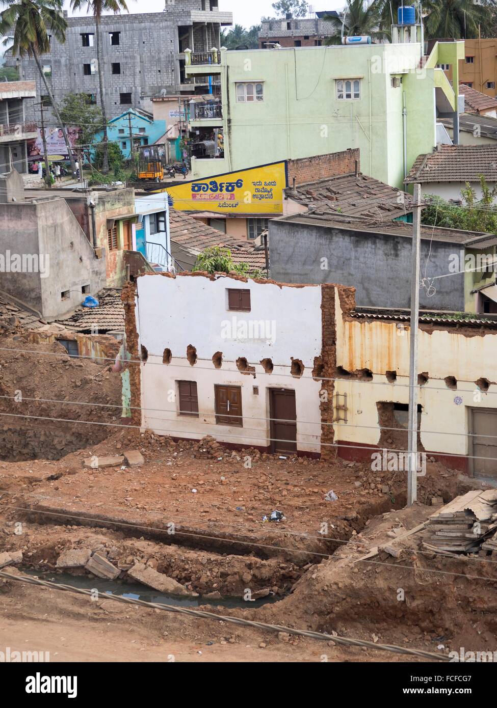 Street scene and ruined buildings cut in half to make way for highways ...
