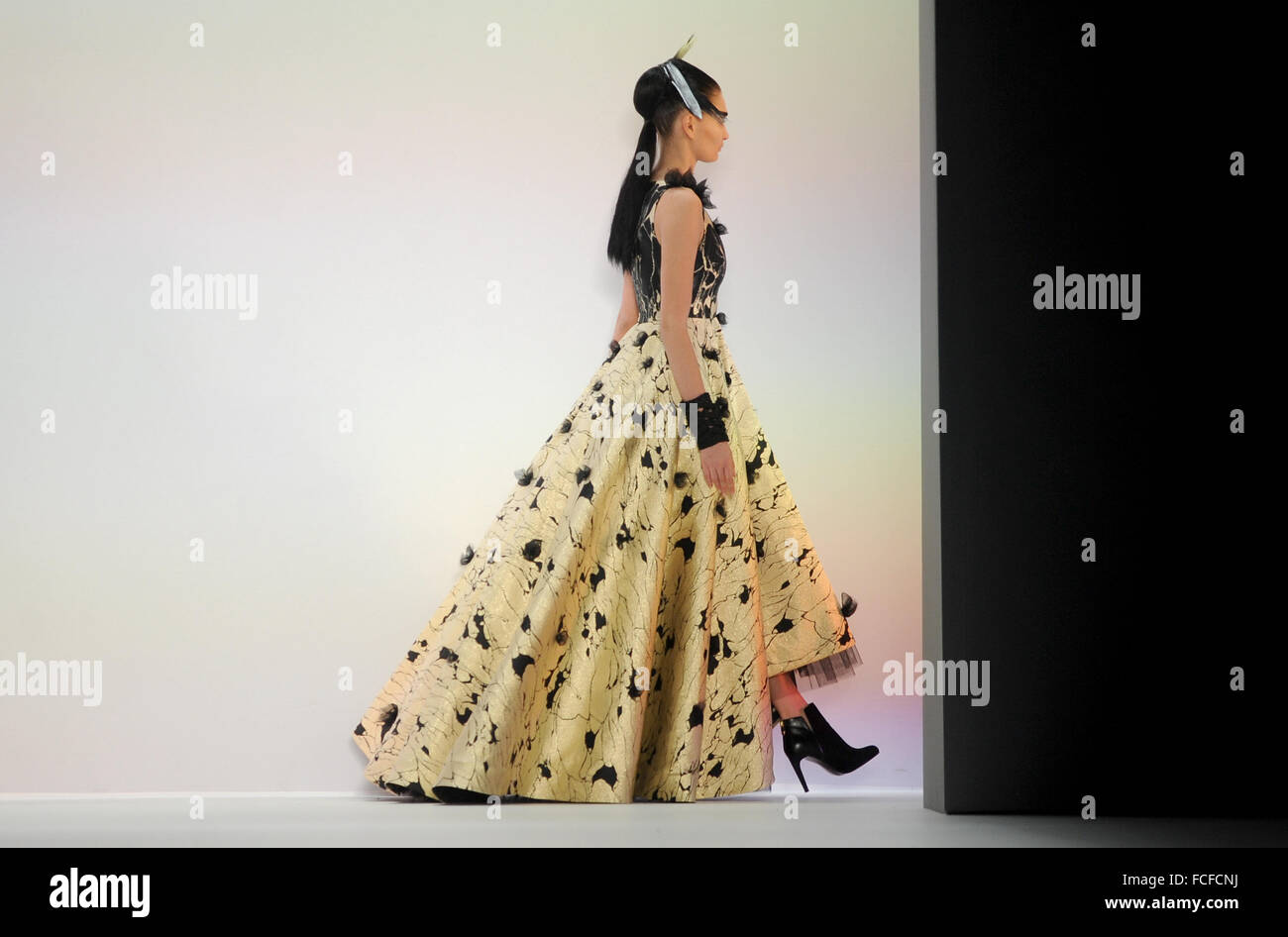 Berlin, Germany. 22nd Jan, 2016. A model presents a creation of fashion ...