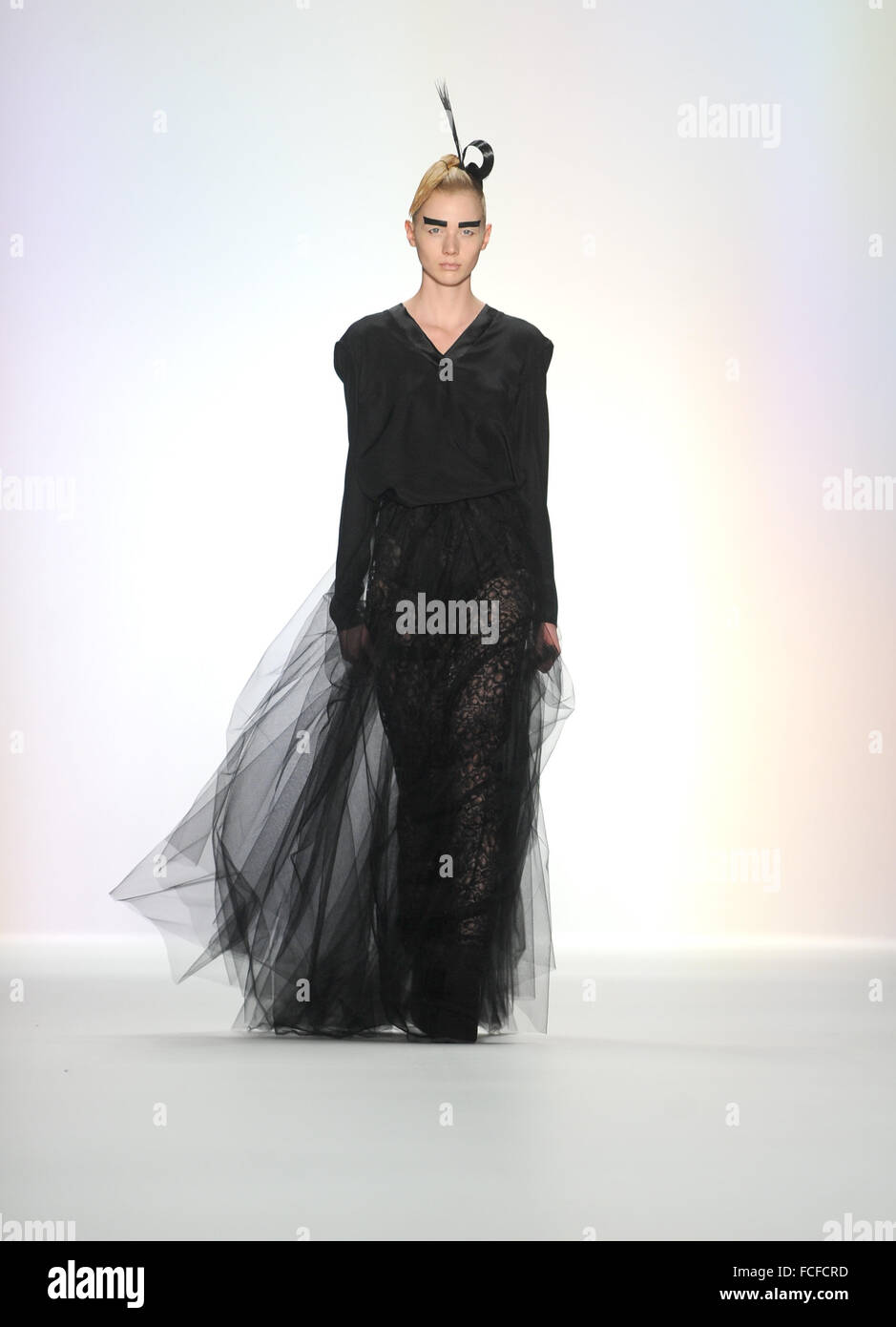 Berlin, Germany. 22nd Jan, 2016. A model presents a creation of fashion ...