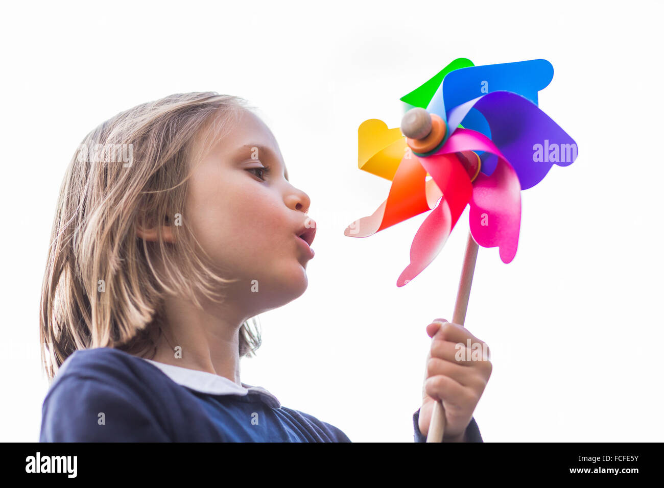 Girl blowing toy windmill hi-res stock photography and images - Alamy Girl blowing toy windmill hi-res stock photography and images - Alamy