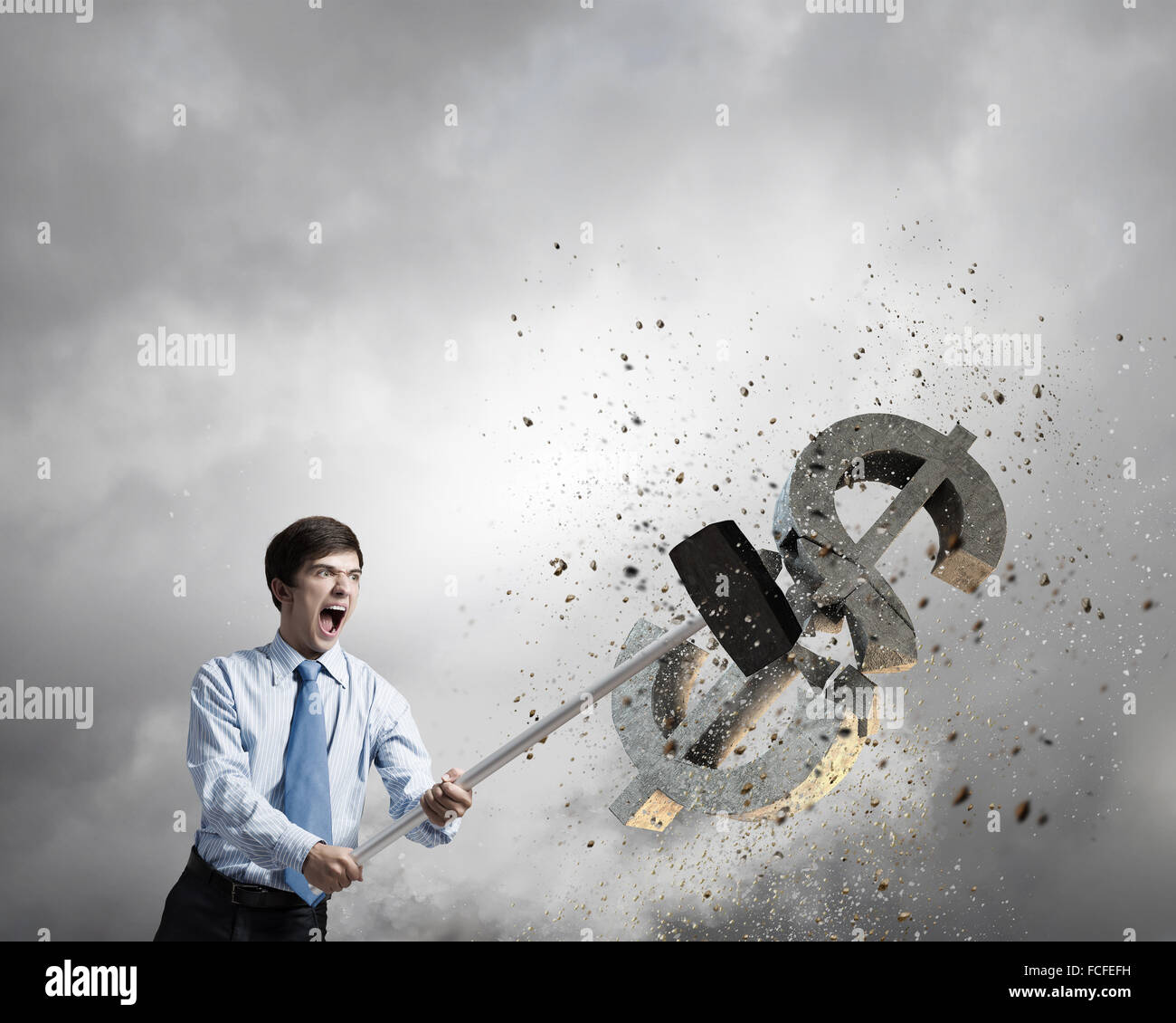 Young businessman crashing with hammer stone dollar symbol Stock Photo ...