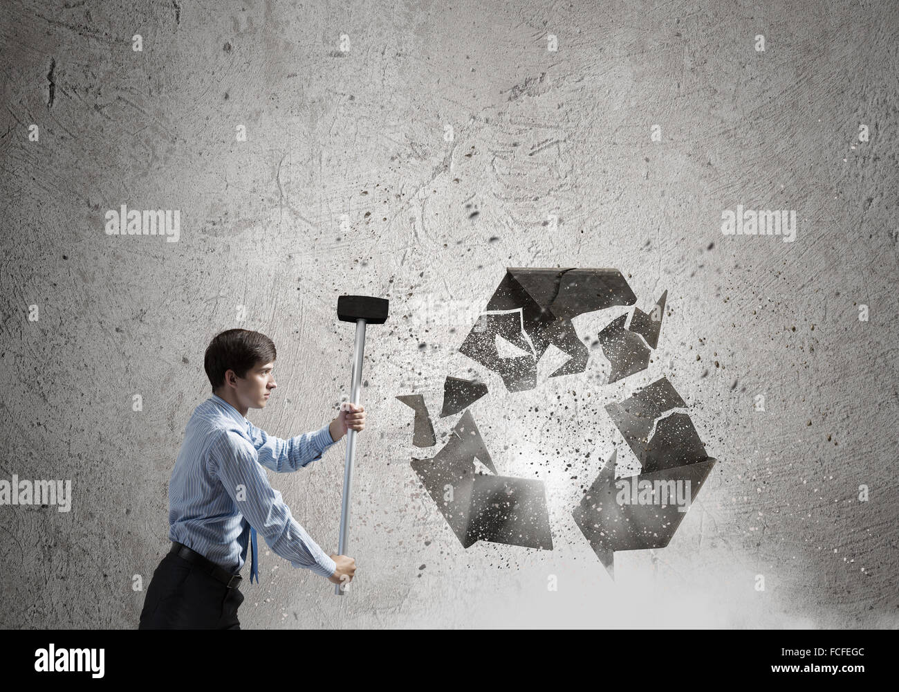 Young businessman in anger crashing stone recycle symbol Stock Photo ...