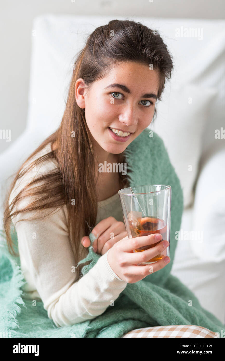 Woman drinking hot beverage Stock Photo - Alamy