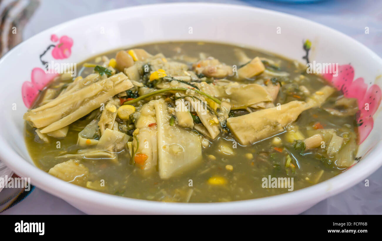 Thai spicy soup with bamboo shoots and herbs , Thai rustic style food ...