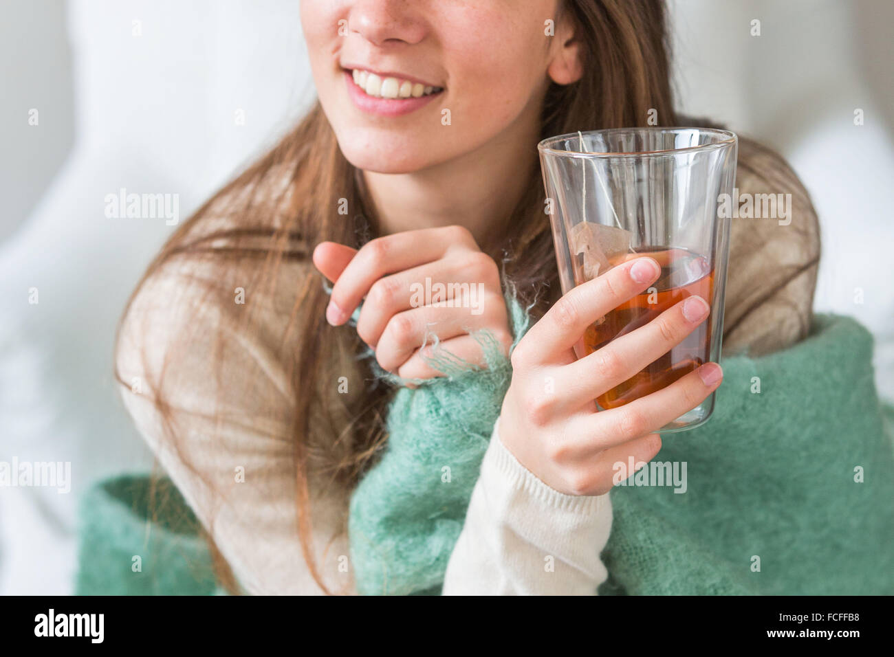 Woman drinking hot beverage Stock Photo - Alamy
